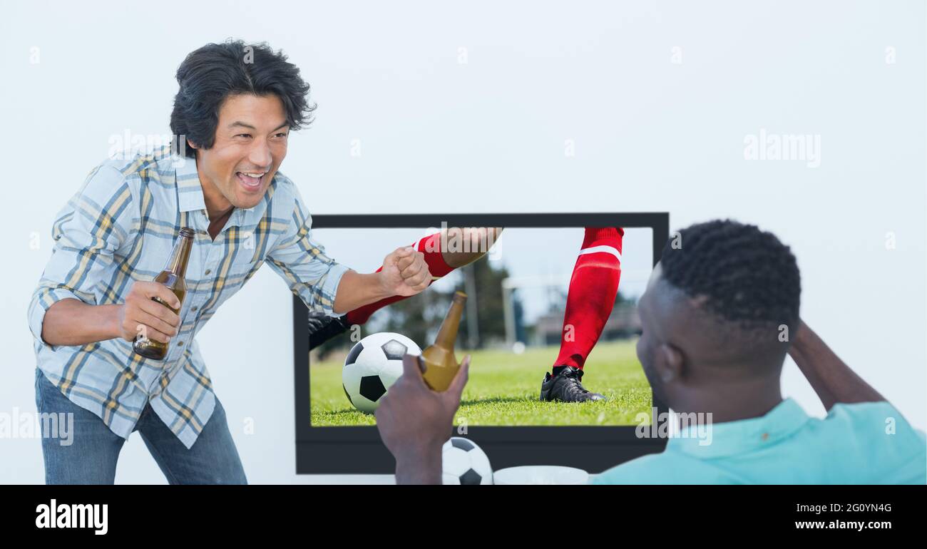 Compostion of diverse male friends watching football match on tv on ...