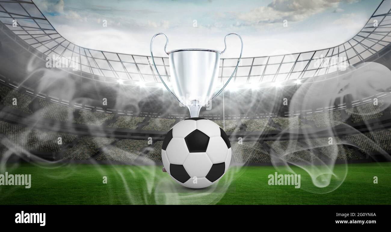 Compostion of cup and football over stadium and white smoke Stock Photo ...