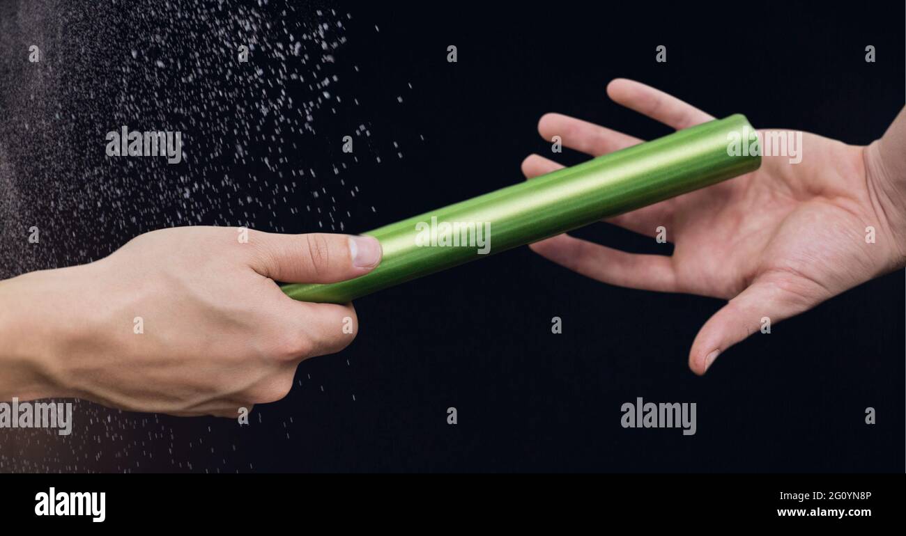 Composition of caucasian male runner passing baton to his teammate on ...