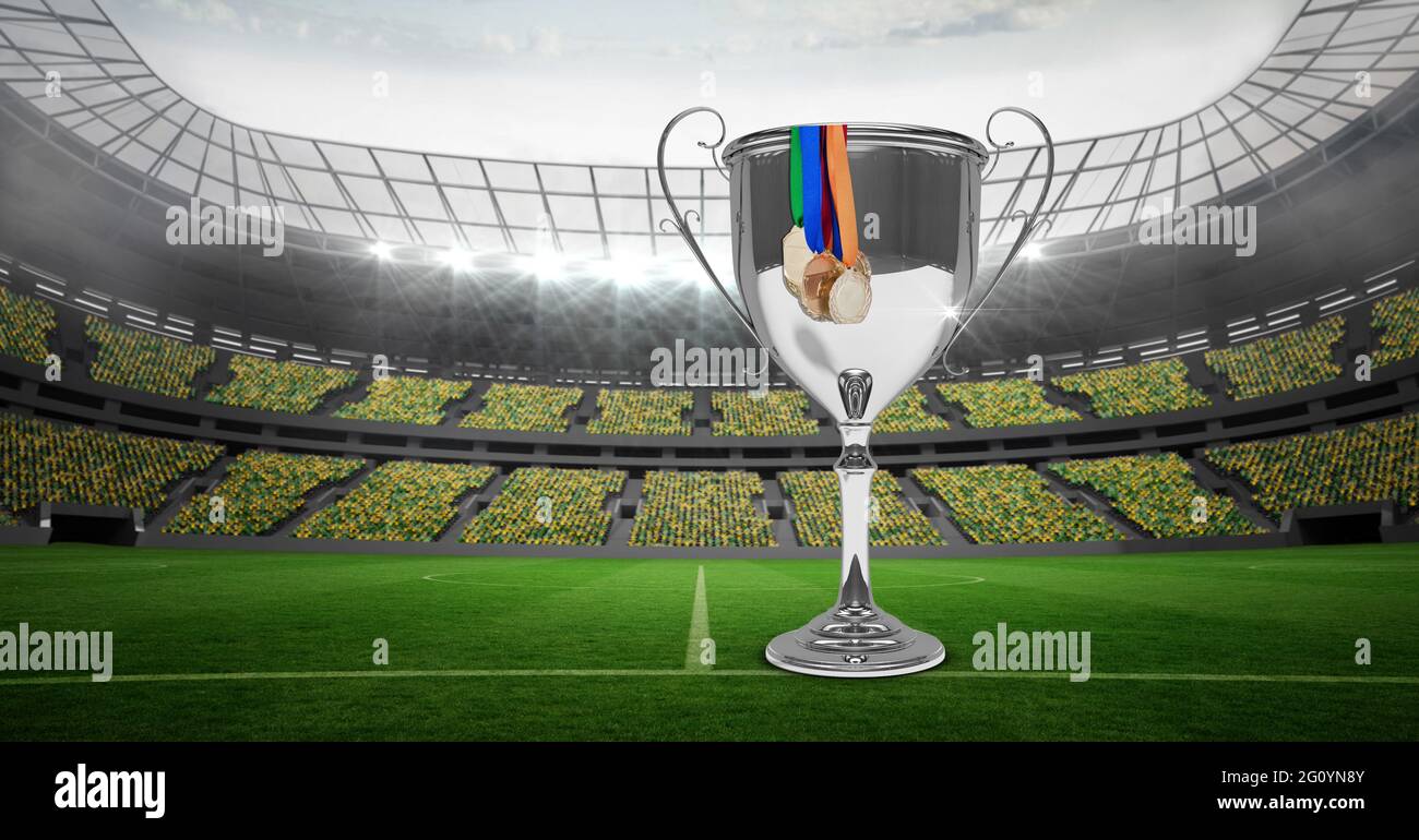 Compostion of cup and medals over football stadium Stock Photo - Alamy