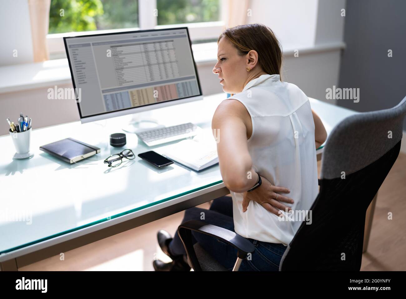 Back Pain And Bad Posture Stress At Office Computer Stock Photo - Alamy