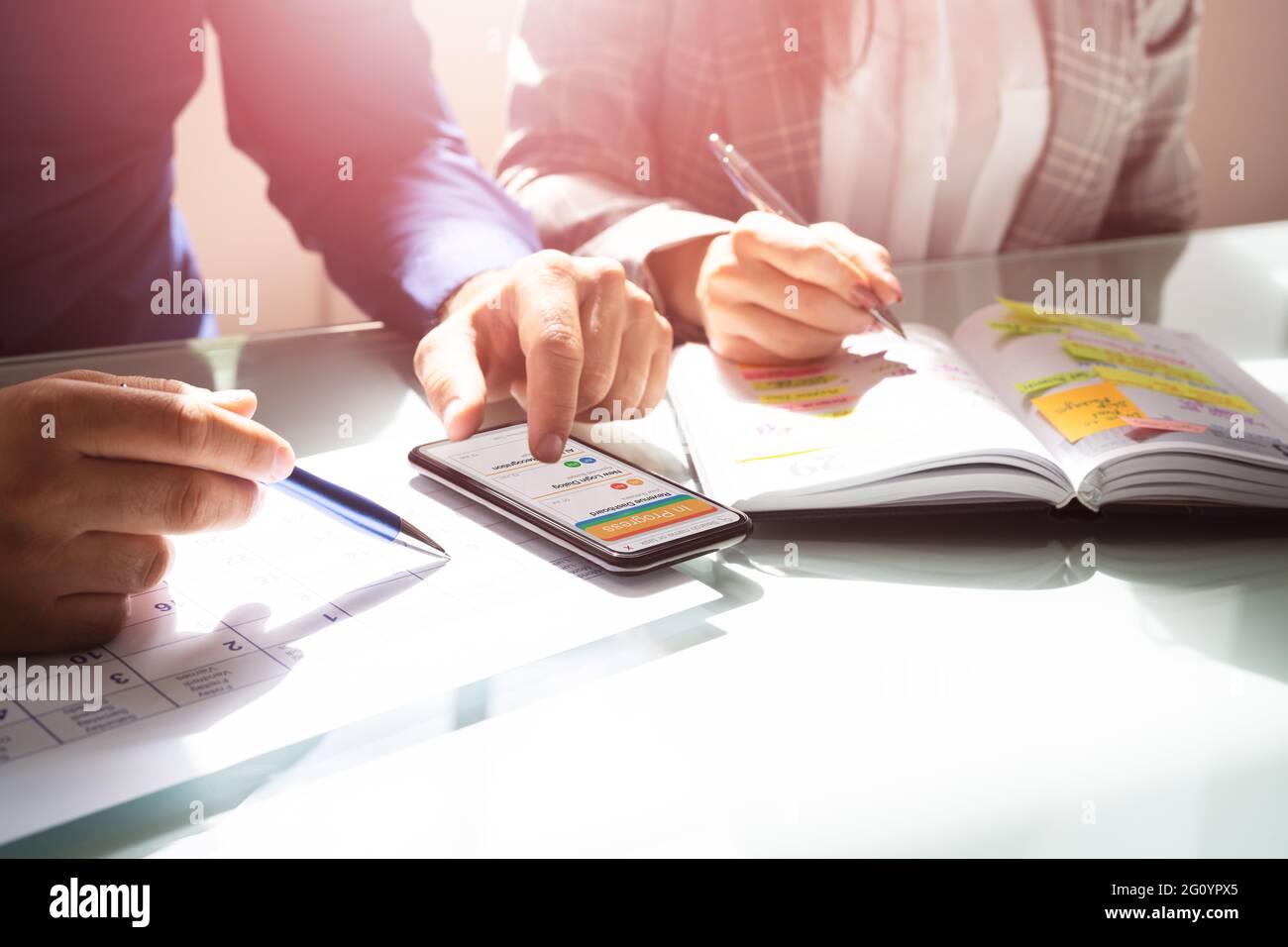 Looking At Calendar Schedule In Agenda Organizer Stock Photo - Alamy