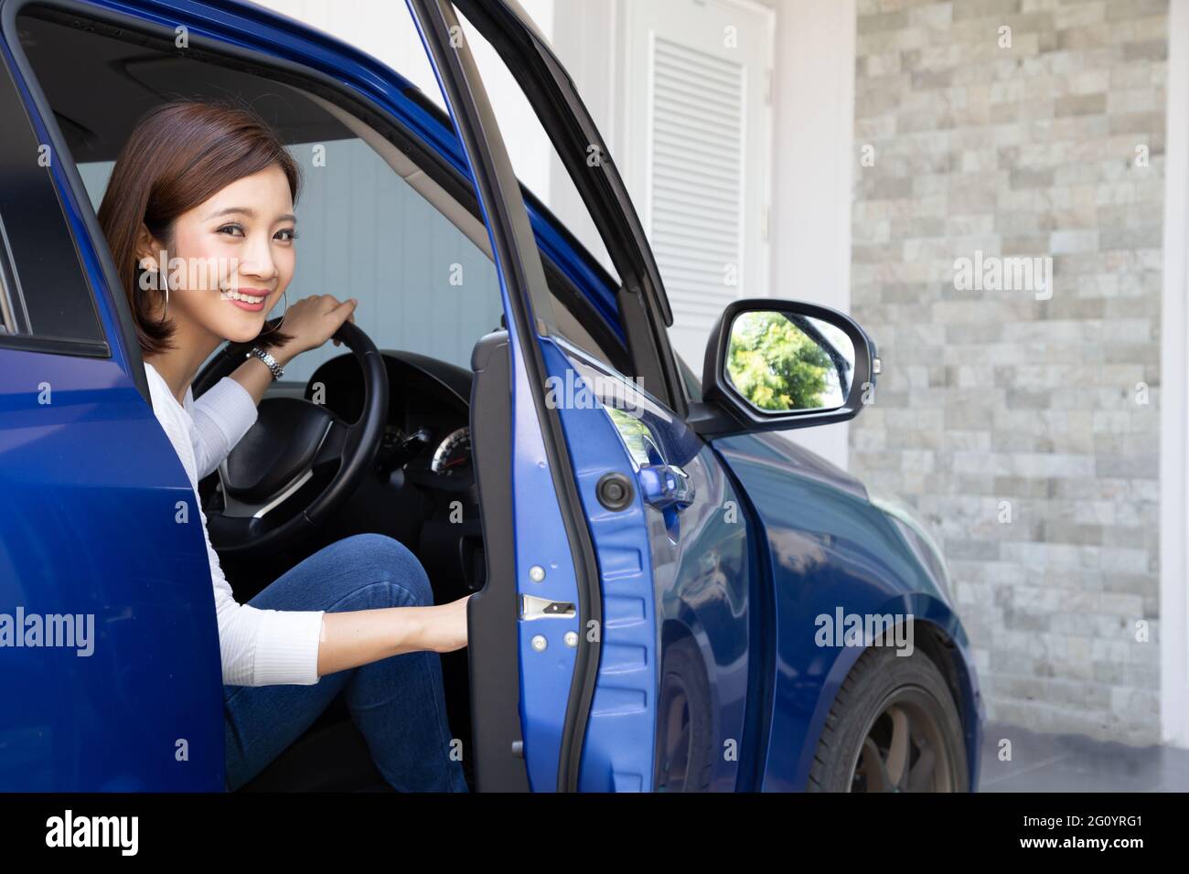 Getting out of car in front of house hi-res stock photography and ...
