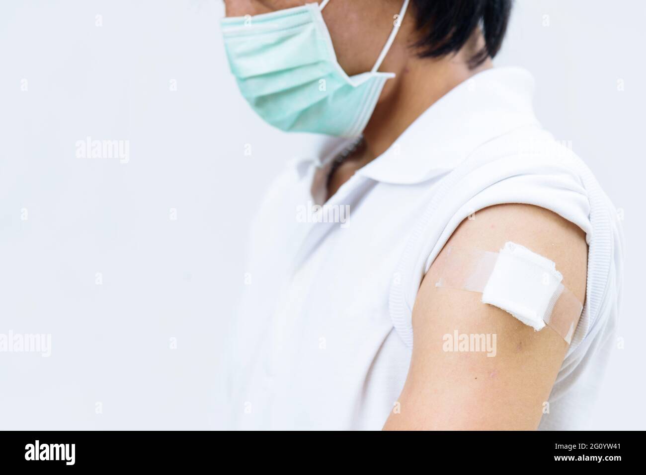 asian man wear mask and get vaccinated of covid-19 Stock Photo - Alamy