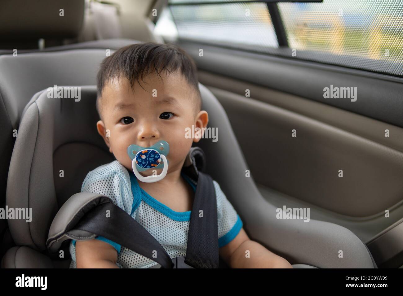 Local lifestyle Asian Chinese baby boy with emotion face and sucking ...