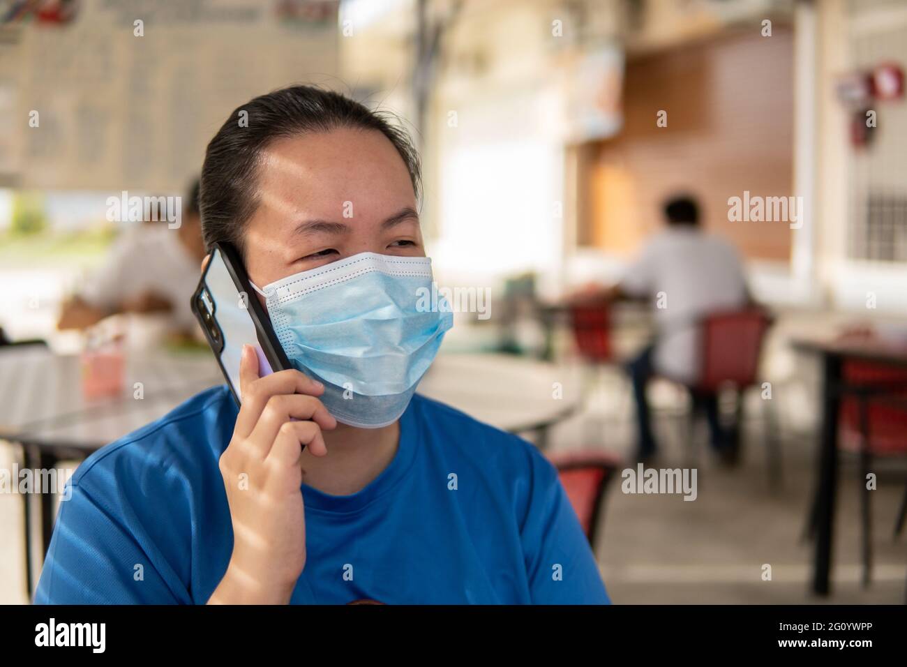Local lifestyle Asian Chinese women Wearing Face Mask To Protect Her ...