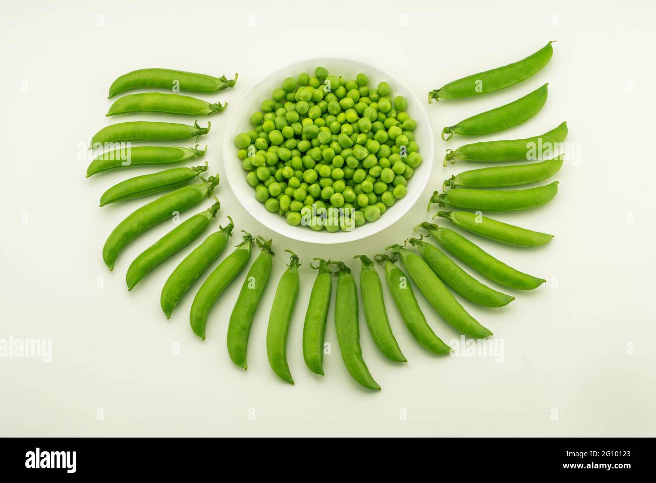 Closeup top view of fresh green peas,Pisum Sativum, pods and seeds ...