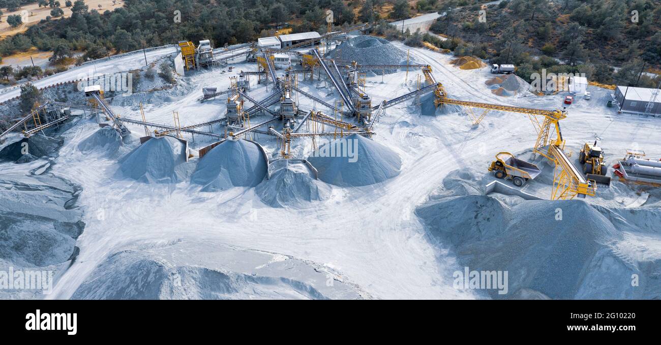 Aerial panorama of stone crushing and screening plant with piles of ...