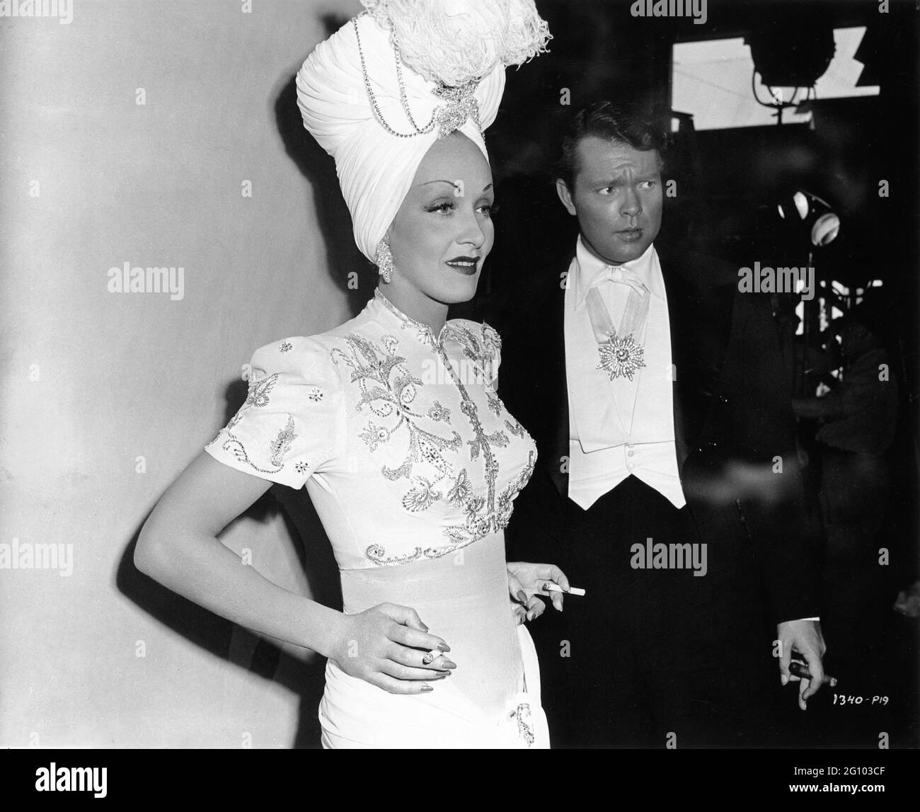 MARLENE DIETRICH and ORSON WELLES on set candid during filming of the ...