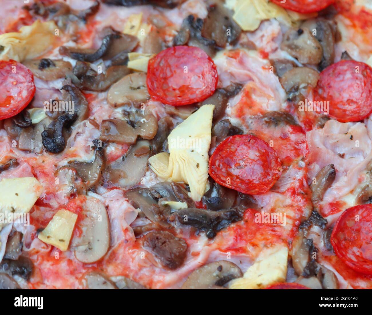 detail of pizza called capricciosa with mushrooms artichokes spicy ...