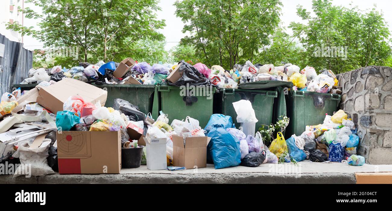 Overloaded dumpster, full garbage container, household garbage bin ...