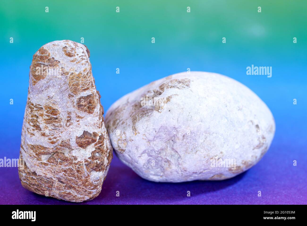 Closeup shot of granite rocks on a colorful background Stock Photo - Alamy