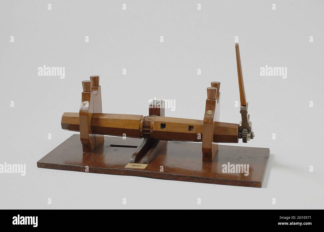 Model or a windlass. Model of a roasting pill on a floor plank. The drum, hanged between two ...