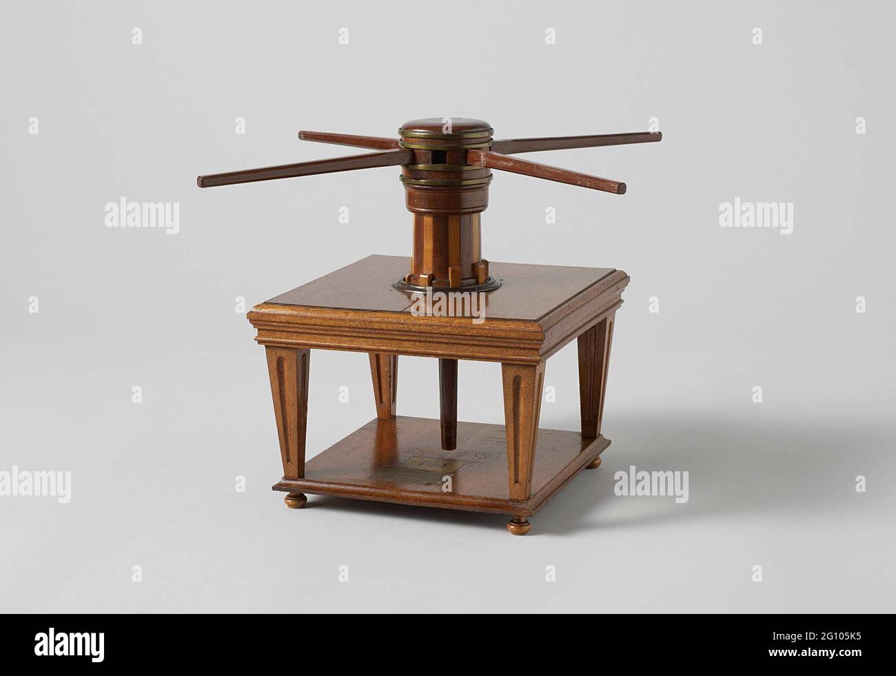 Model or a capstan. Model of a capstan in a wooden frame of two levels ...