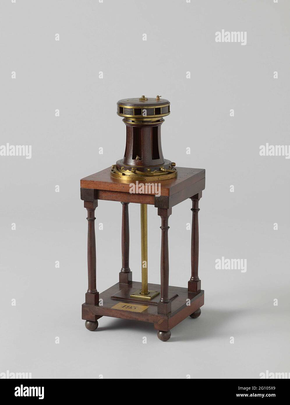 Model or a capstan. Model of a capstan in a wooden frame of two levels ...