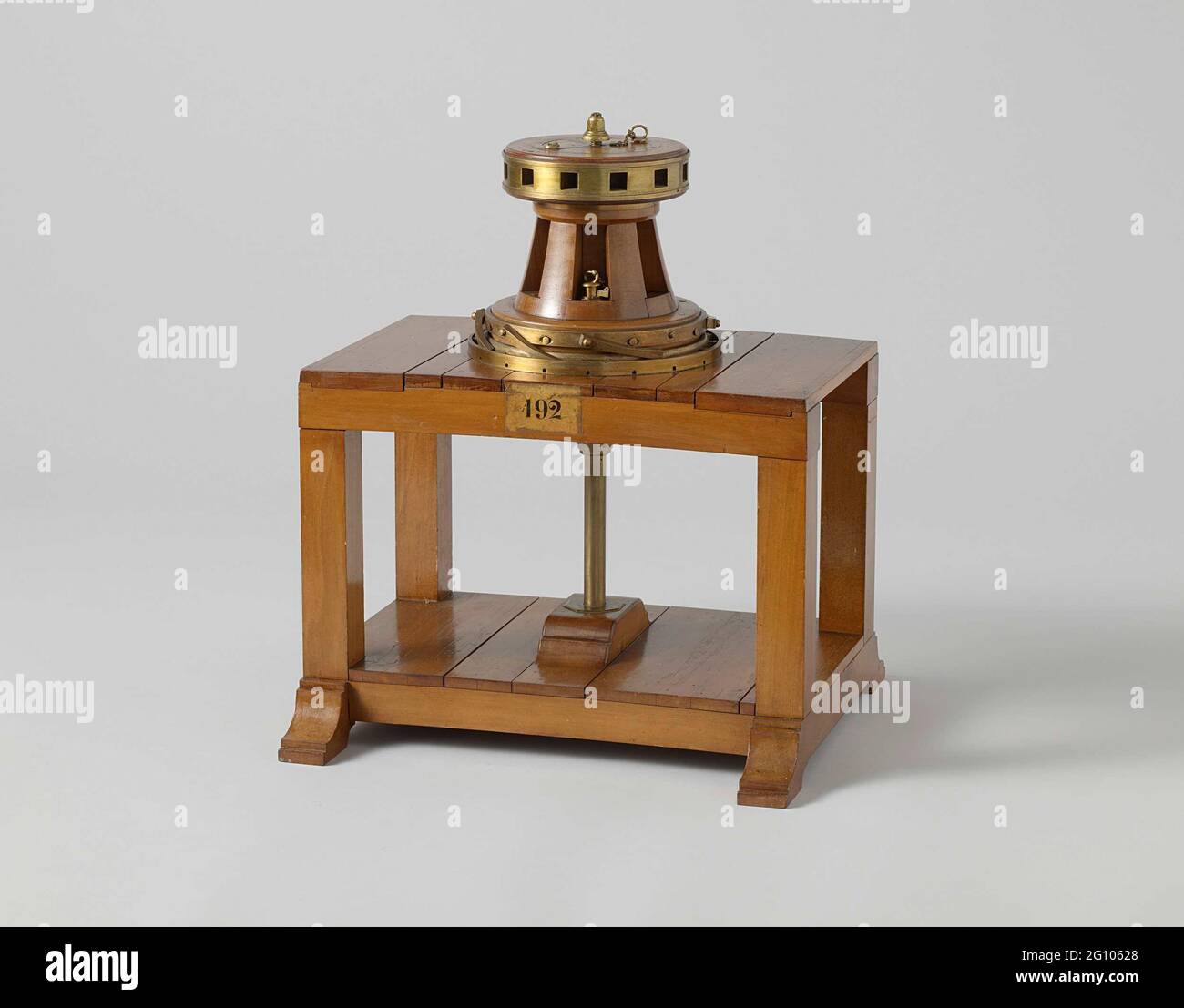 Model or a capstan. Model of a capstan in a wooden frame that ...