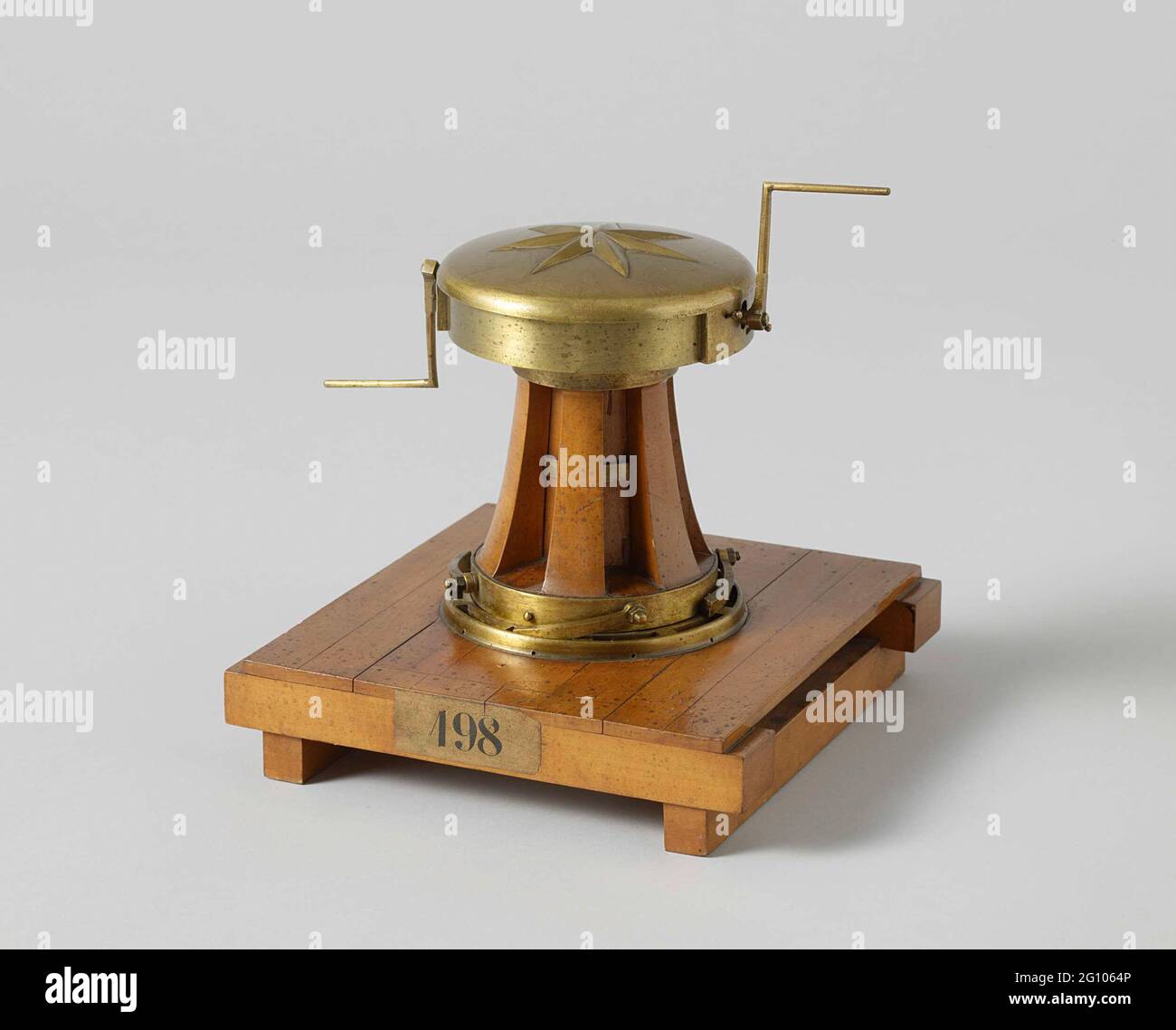 Model of a Capstan with a winch. Model of a capstan on a wooden floor ...