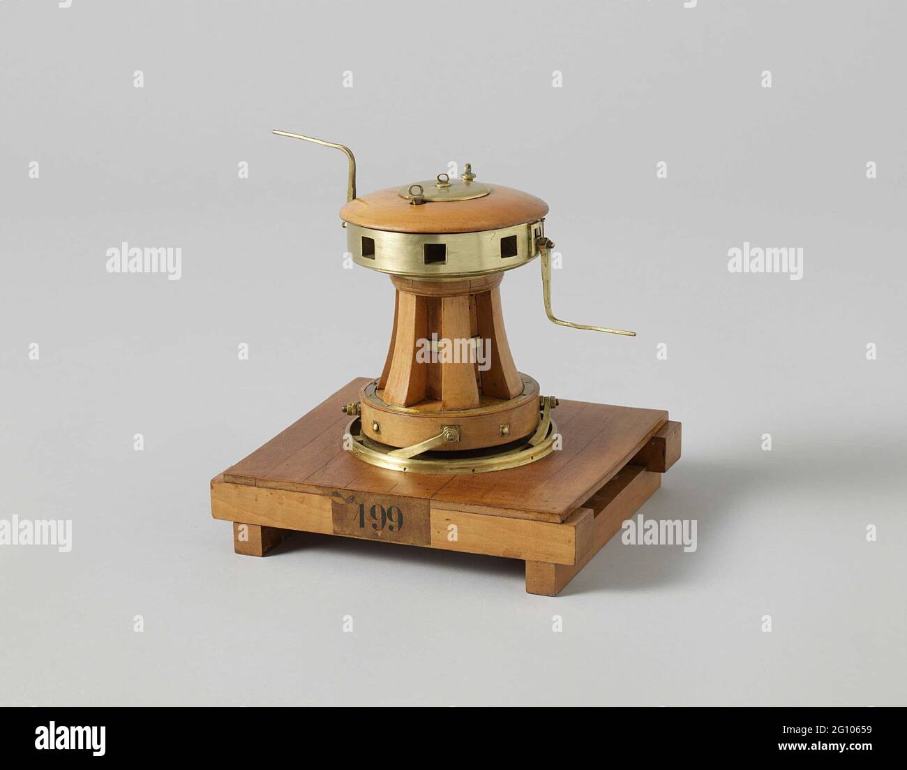 Model of a Capstan with a winch. Model of a capstan on a wooden floor ...