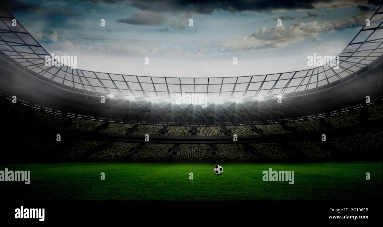 Football on football pitch in the spotlight High Resolution Stock ...