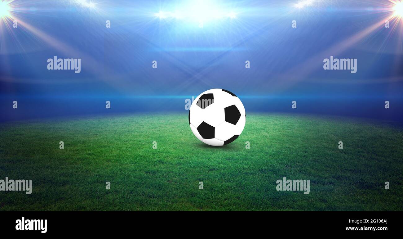 Composition of football on football pitch with spotlights in sports ...