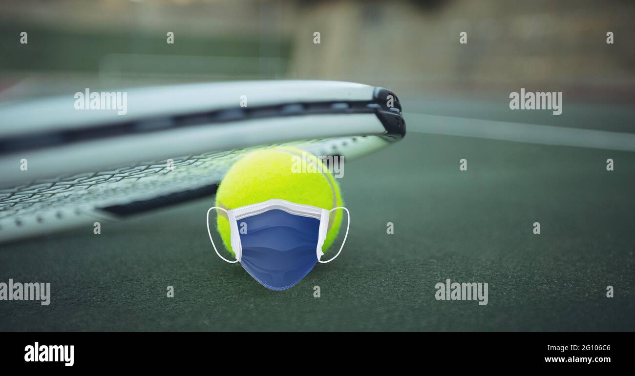 Composition of tennis ball with face mask and tennis racket on tennis ...