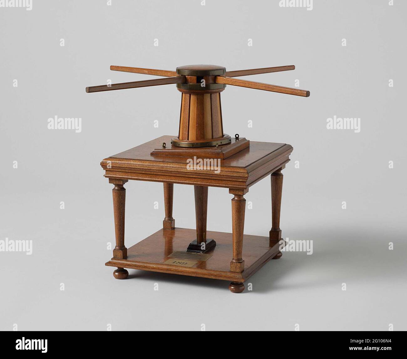 Model or a capstan. Model of a capstan in a wooden frame of two levels ...