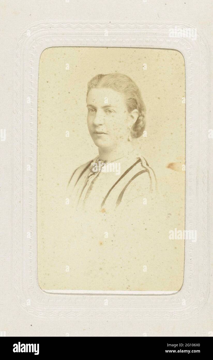 Studio portrait of a woman with raised hair Stock Photo - Alamy