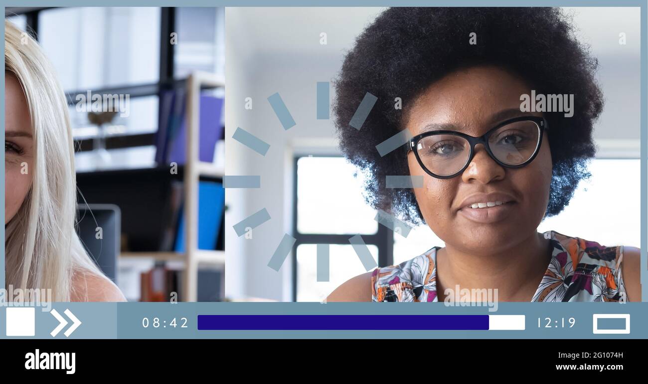 Composition of two businesswomen having video call on video playback ...