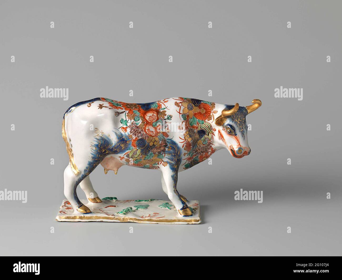 Cow, decorated with flowers. Faïence animal figure, representing a cow ...