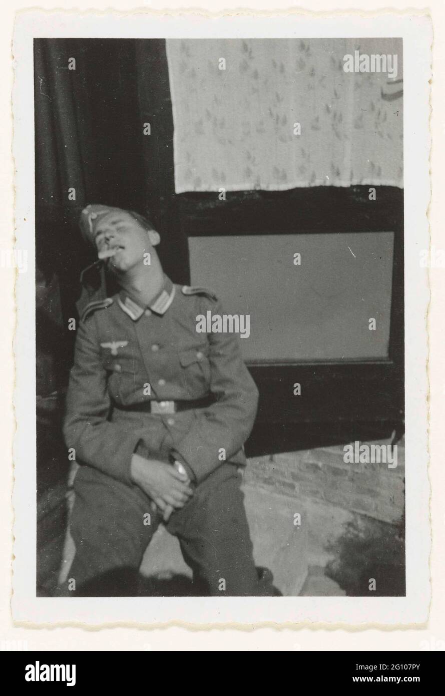 Sleeping soldier. A German Wehrmacht soldier has fallen asleep. Rear ...
