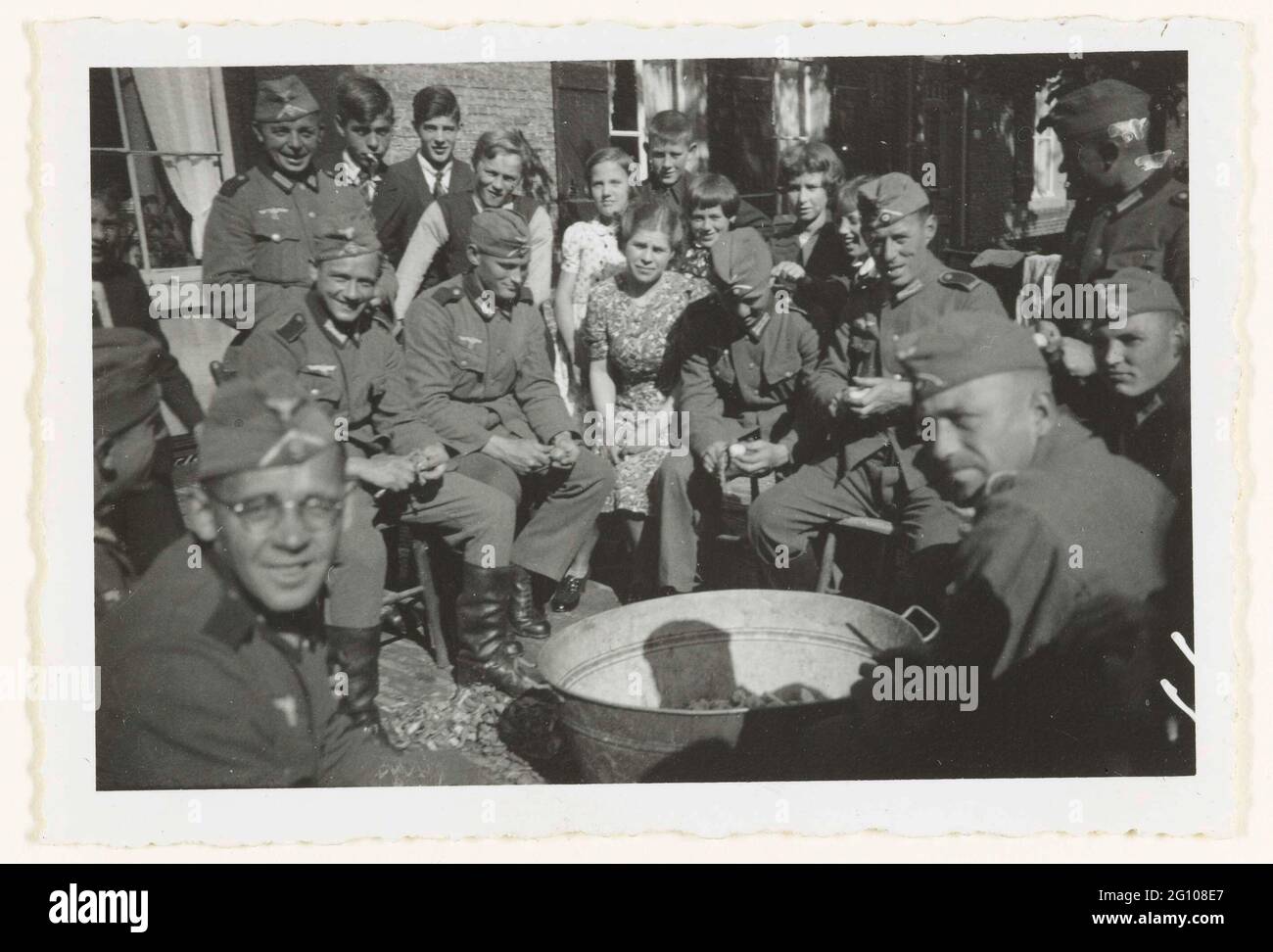 German soldiers peel potatoes .. Ten German soldiers help peel with ...