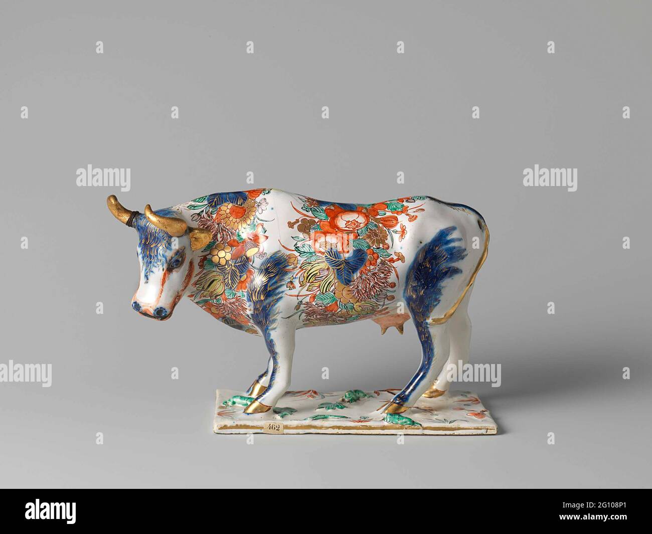 Two Cows. Faïence animal figure, representing a cow. Many color painted ...