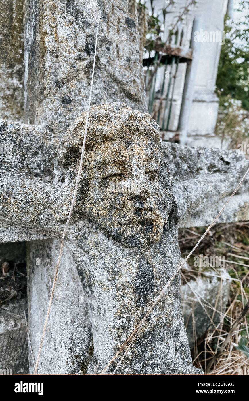 Vertical image. Closeup view of unnamed gravestone on old abandoned ...