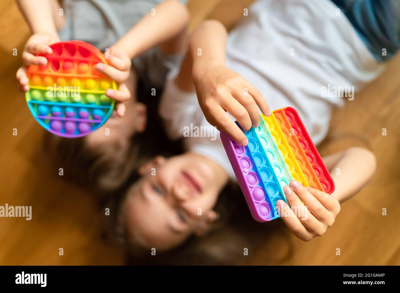 anti stress sensory pop it toys in a children's hands. a little happy ...