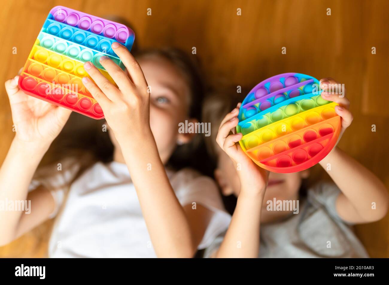 anti stress sensory pop it toys in a children's hands. a little happy ...