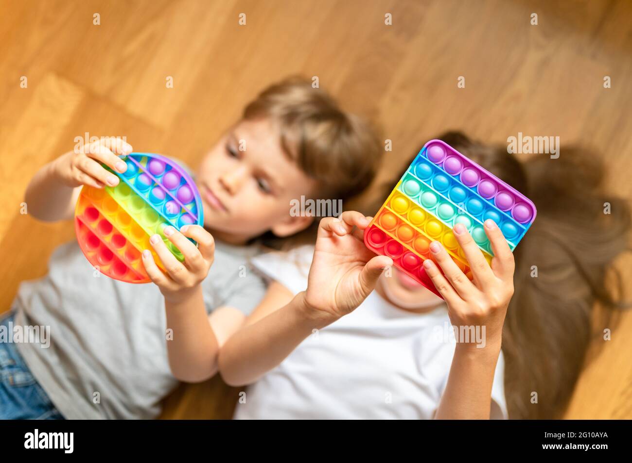 anti stress sensory pop it toys in a children's hands. a little happy ...