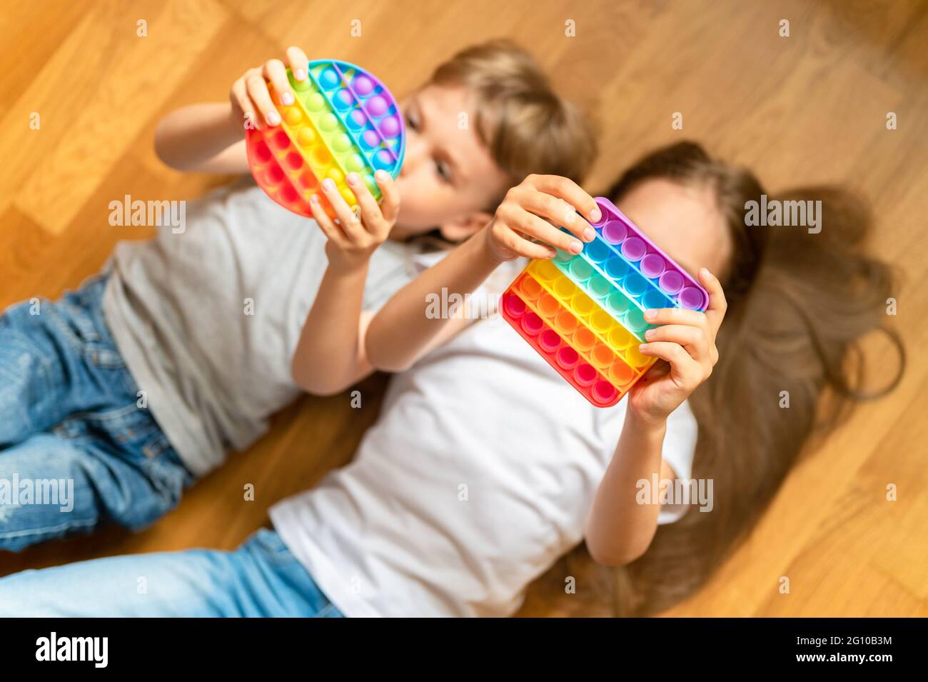 anti stress sensory pop it toys in a children's hands. a little happy ...