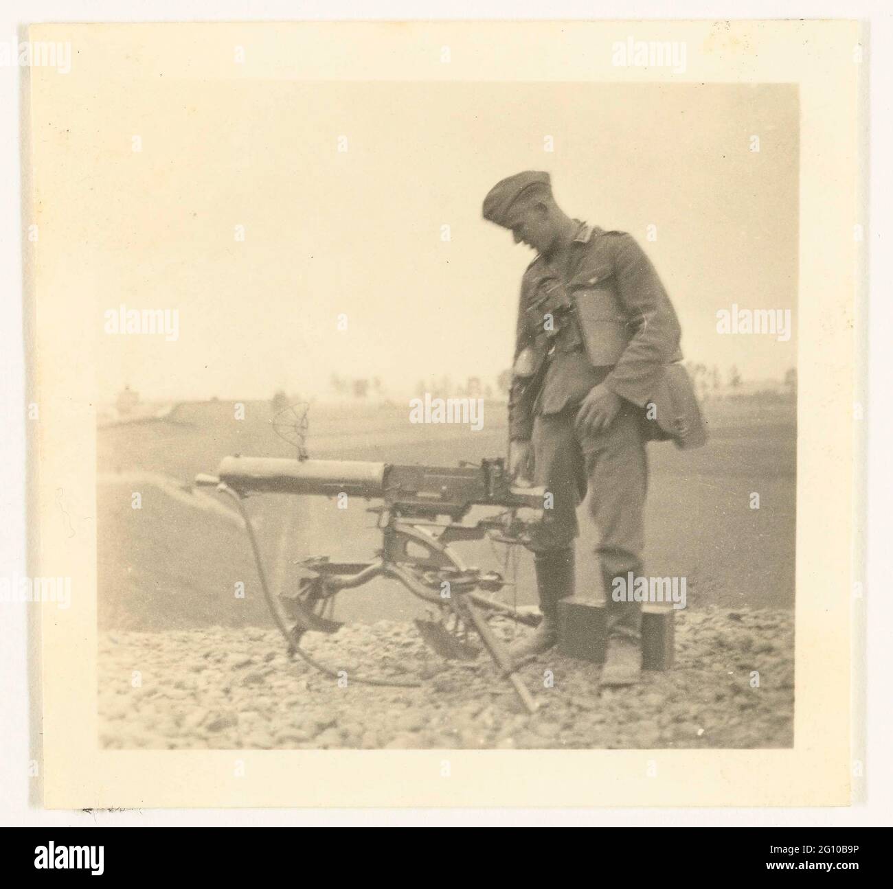 Wehrmacht soldier at machine gun. A German soldier is in an open site ...