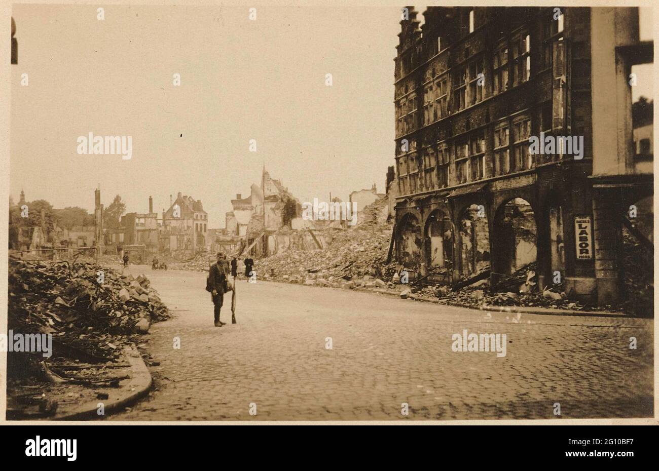 Soldier in a bombed street. Soldier with rifle is in a bombed street ...