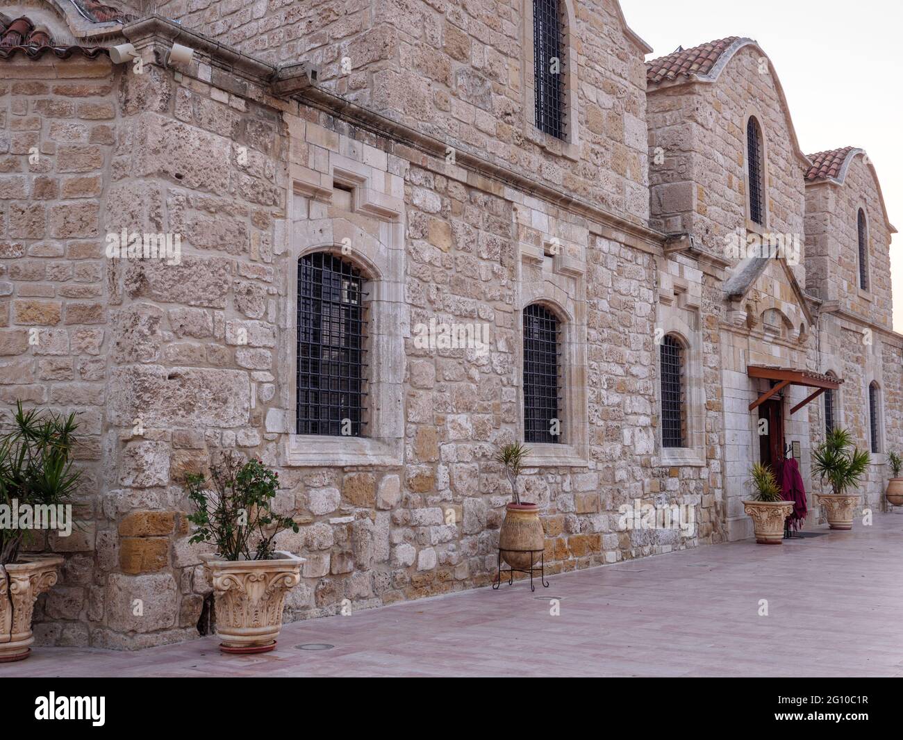 Close view of a facade stone wall of an old church in Larnaca city ...