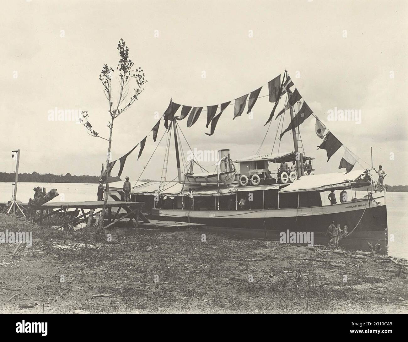 Ship to jetty. A ship (De Poeloe Miang) located on a jetty in Borneo ...