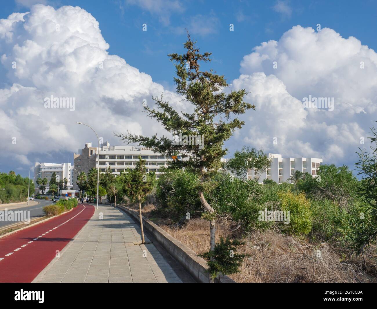 Picturesque road with cycle lanes to Ayia Napa, Cyprus. Cityscape with ...