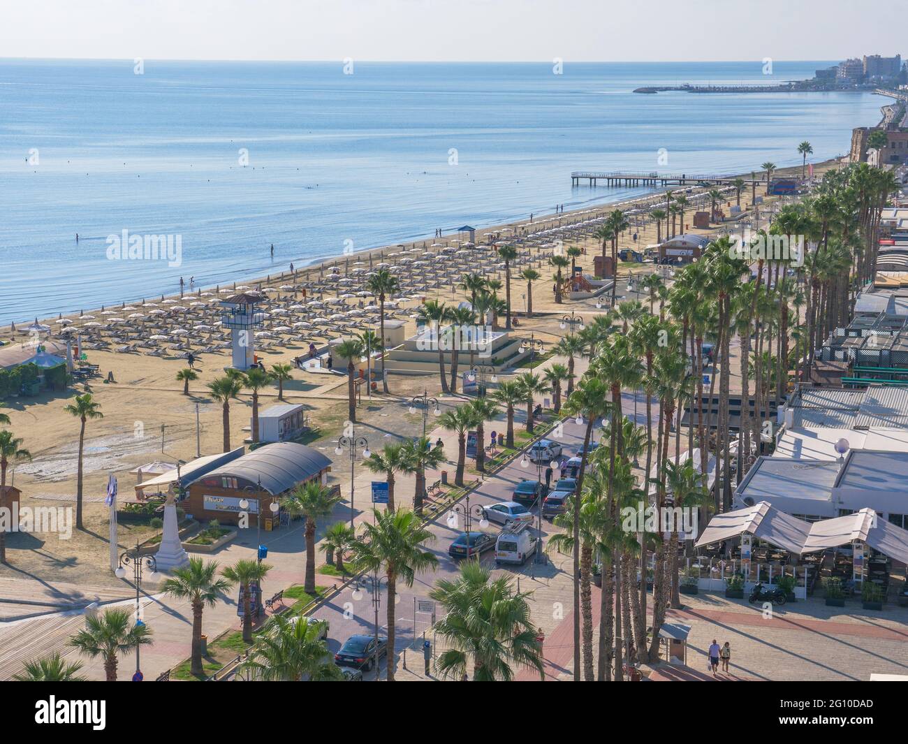 Top aerial view overlooking Finikoudes promenade with palm trees along ...