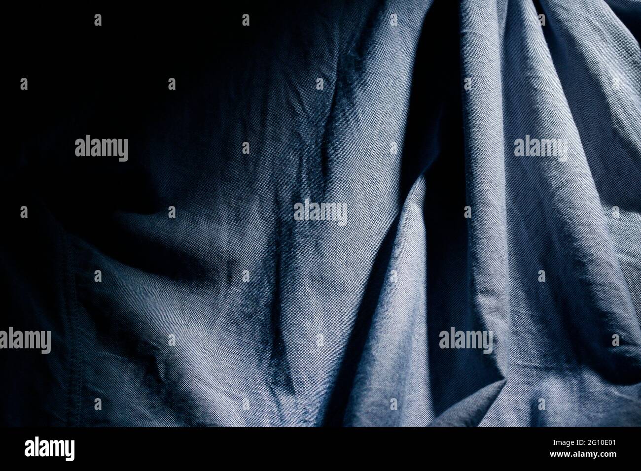 Dramatic lighting on denim fabric. Background, wallpaper Stock Photo ...