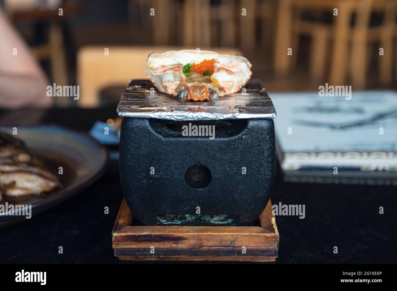 Kani Miso with Ebiko shrimp roe in crab shell grilling on japanese ...
