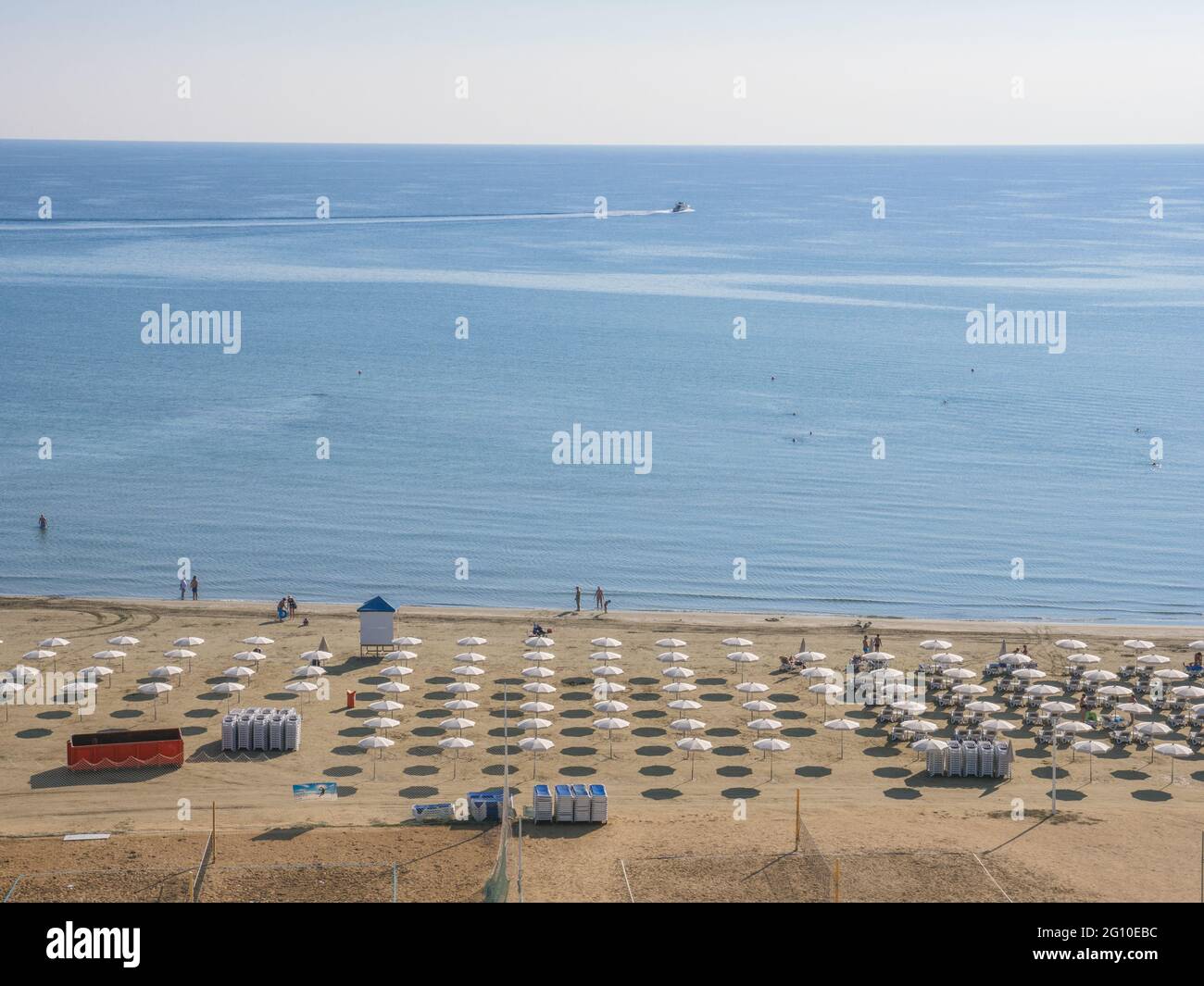 Top aerial view overlooking sunny picturesque beach with people ...