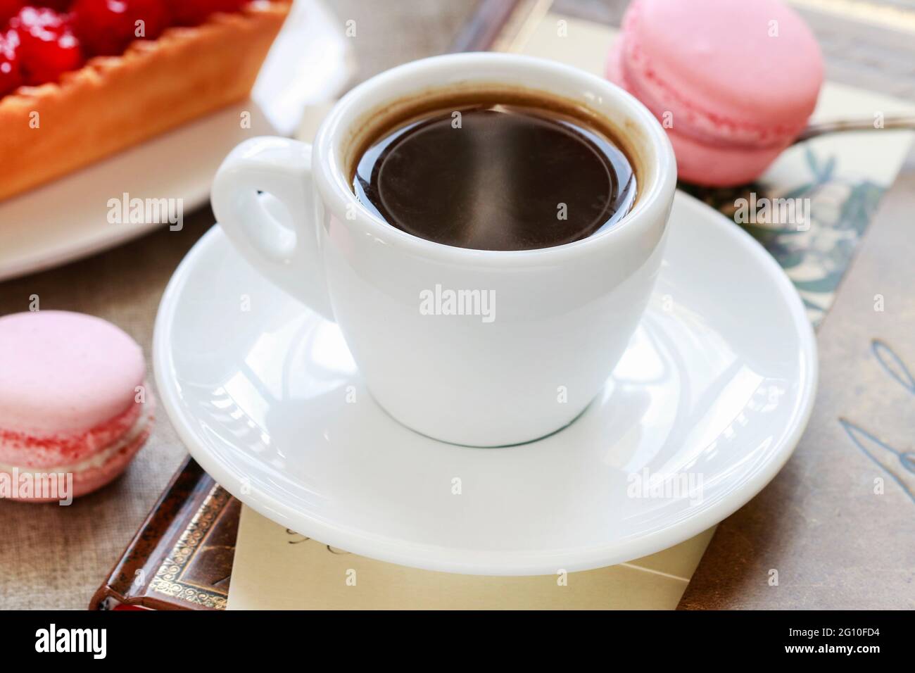 Cup of coffee and sweets around. Party dessert Stock Photo - Alamy