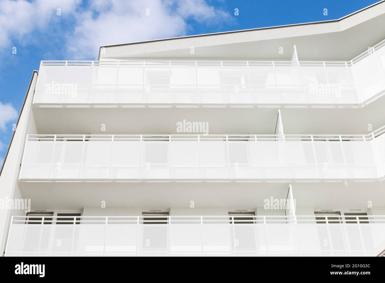 Modern all white apartment building Stock Photo - Alamy