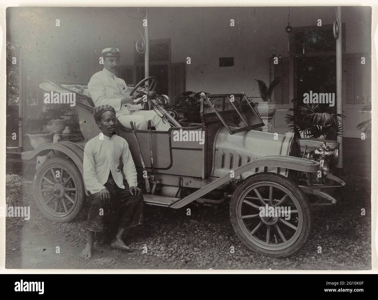 Mr. Letterie in his car with clerk for his home in Mojosari. Mr ...