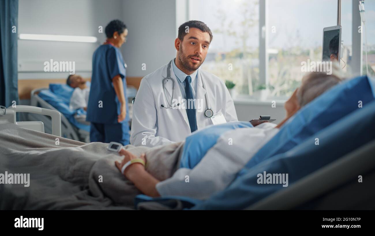 Hospital Ward: Friendly Doctor Talks to Beautiful Senior Female Patient ...